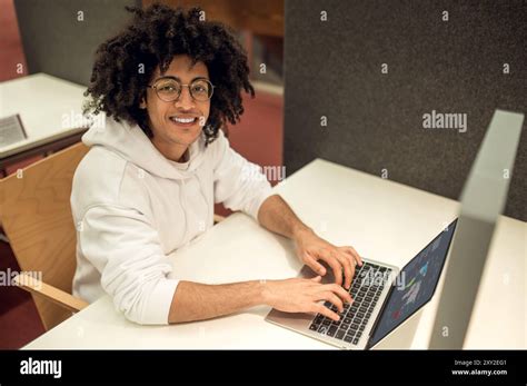 Man Studying With Computer Preparing For Exams In High Babe Library Stock Photo Alamy