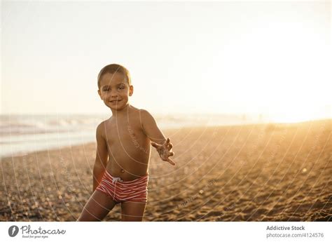 Glad Shirtless Gay On Beach A Royalty Free Stock Photo From Photocase