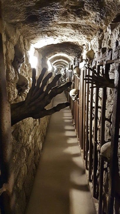 Free Gloomy Catacomb Passageway Image Catacomb Eerie Skulls
