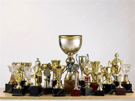 Premium Photo Close Up Of Trophies On Table Against White Background