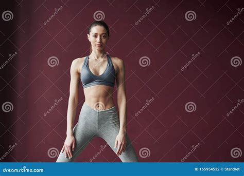 Legs Spreaded Wide Girl With Good Fitness Body Type Have Exercises In