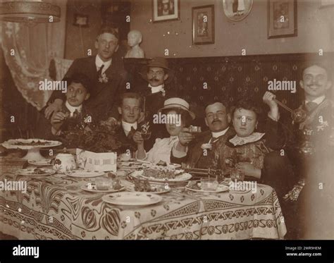 Group Portrait Of Six Unknown Partying Young Men And Two Women In The