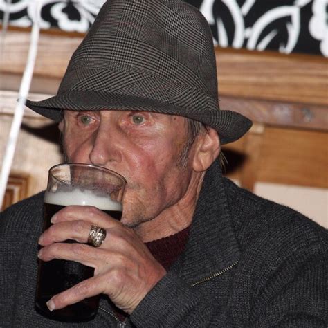 Premium Photo Old Man Wearing Hat With Drink