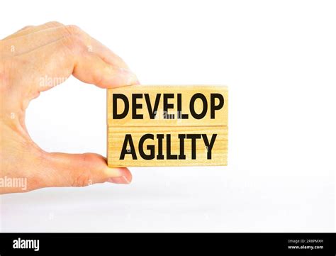 Develop Agility Symbol Concept Words Develop Agility On Wooden Blocks On A Beautiful White