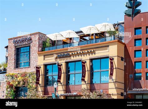 Facade Of The Teleferic Barcelona Restaurant Building With Signs For