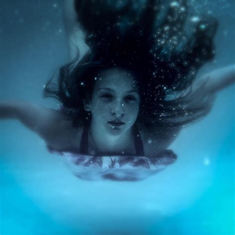 Premium Photo Portrait Of Girl Swimming In Pool