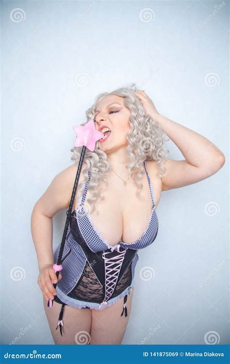 Caucasian Curvy Girl In Erotic Lingerie With Leather Bdsm Riding Crop Standing As Advanced