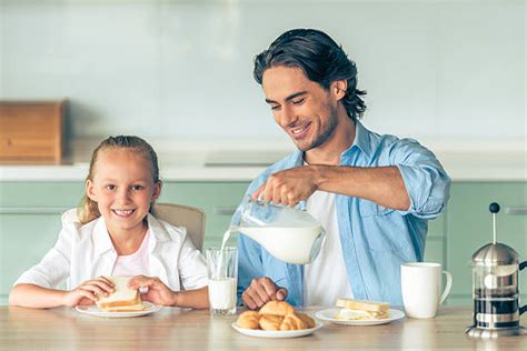 50+ Happy Father Pouring Milk To His Small Girl At Kitchen Stock Photos, Pictures & Royalty-Free ...