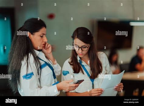 Group Of Female Security Operators Working In A Data System Control Room Technical Operators