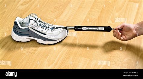 Friction Measurement Experiment Spring Balance Being Used To Measure The Frictional Force