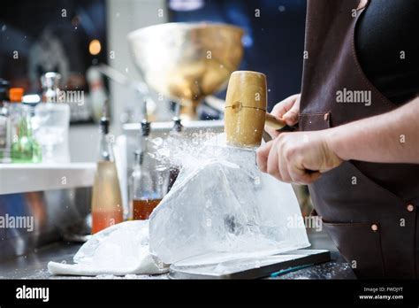Bartender Mannually Crushed Ice With Wooden Hammer And Metal Knife Stock Photo Alamy