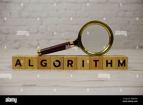 Algorithm Alphabet Letters And Magnifying Glass On Wooden Background