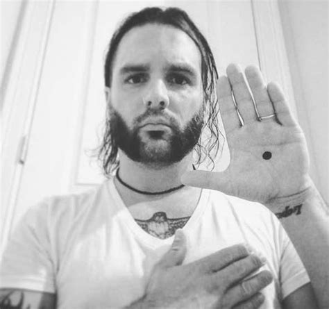 Why People Are Posting Photos Of Black Dots On Their Hands Yourtango