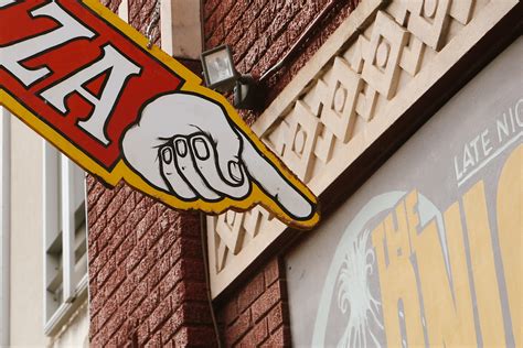 Austin Texas Pizza Sign Pointing Mike Capson