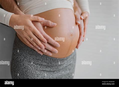 Pregnancy photo man and woman holding pregnant bump expecting baby ...