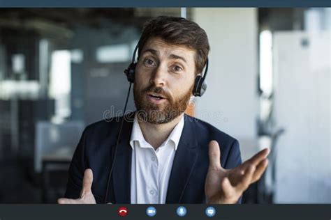 Businessman Making Video Call From Office Wearing Headphones And Talking To Webcamera Pov