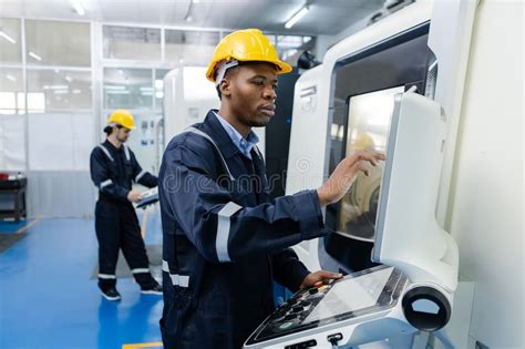 Man African American Engineer Using Computer Controlling Cnc Machine At