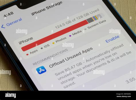 Storage settings page is seen on an iPhone. System recommendation ...