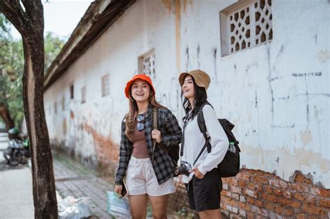 Attractive Asian Backpacker Girl Confused To Find A Tourist Destination