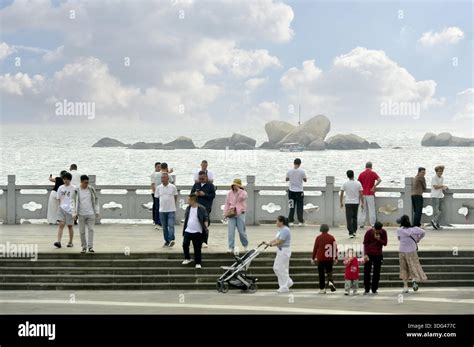 Tourists Visit The Coastal Area Of Tianya Haijiao Scenic Area In Sanya