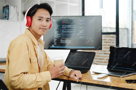 Premium Photo Programming Programmer Working On Computer In It Office Sitting At Desk Writing
