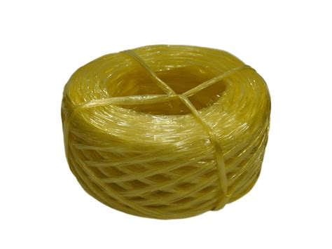 Premium Photo A Roll Of Yellow Plastic Strings On Isolated Background