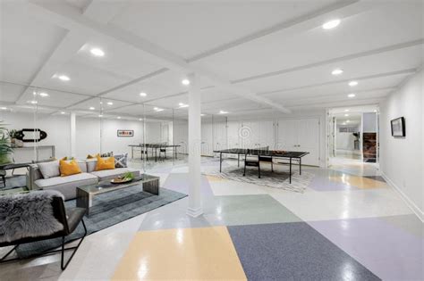 Modern Basement Interior Featuring A Ping Pong Table And Cozy Seating Area With Colorful