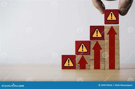 Hand Putting Exclamation Waring And Caution Sign Symbol On Red Up Arrow For High Risk And