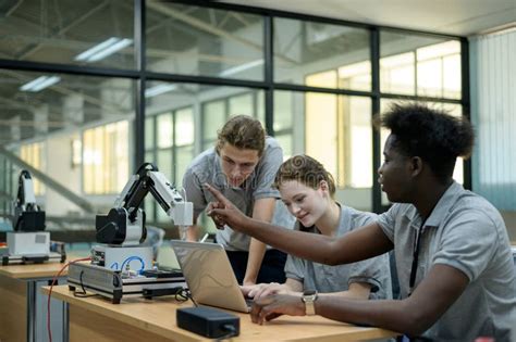 Trainee Robotics Engineer Learning With Programming And Manipulating Robot Hand Industrial