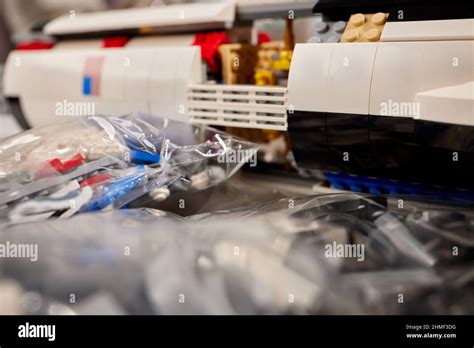 Assembling A Rocket Constructor Colored Plastic Small Blocks Stock