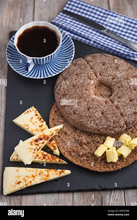 Finnish Breakfast With Mini Farmer Cheeses Leipajuusto Butter Hole Bread Reikaleipa And A Cup
