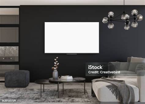 빈 흰색 화면이있는 Led Tv로 집 벽에 매달려 있습니다 Tv 모형 광고 영화 앱 프리젠 테이션을위한 공간을 복사하십시오 디자인에 사용할 수 있는 빈 Tv 화면입니다