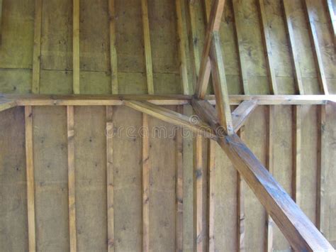 Image Shows A Candid Shot Of A Wooden Interior With Exposed Ceiling And