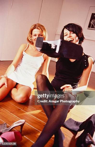 Woman Putting On Stockings Photos And Premium High Res Pictures Getty