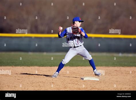 High School Second Baseman At Second Base Accepting A Throw Before Making A Relay On A Double