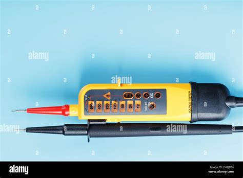 Two Pole Voltage Indicator Close Up On A Blue Background Testing And Verification Of Electrical
