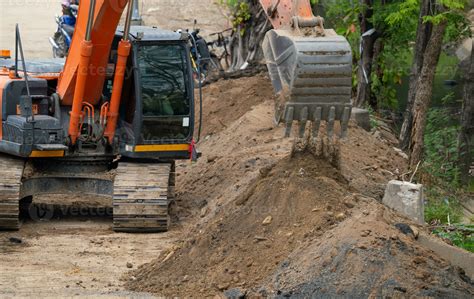 Digger Working By Digging Soil At Construction Site Bucket Teeth Of