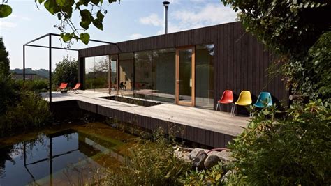10 Homes From Dezeens Pinterest Boards Organised Around Scenic Ponds