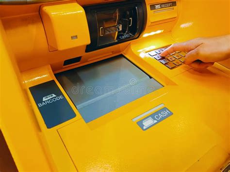 close up of hand entering pin pass code on atm bank machine keypad