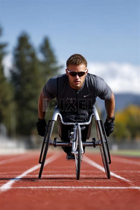 Free Photos Paralympic Wheelchair Athlete Racing On Track In