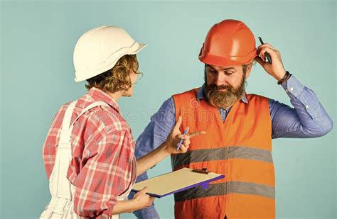 Engineers Couple Working Together On Building Blueprint Work At Construction Site Or Factory