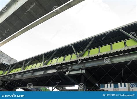 Green Overpass Walkway And Uner View Of Sky Train In Bangkok Thailand