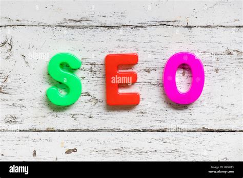 Color Alphabet In Word Seo Abbreviation Of Search Engine Optimization On Grunge Old White Wood