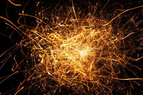 Abstract Glowing Sparks Texture Dynamic Golden Light Particles On A Dark Background Bold And