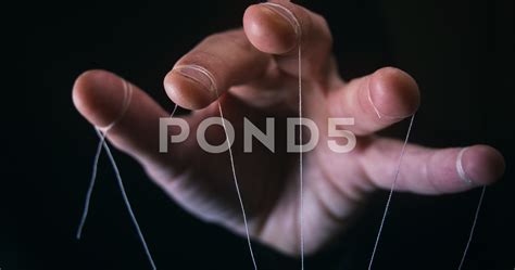 Hand Holding Puppet Strings Hand Holding Puppet Strings