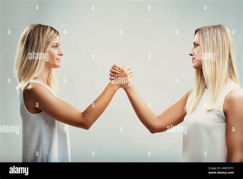 Friendship Is The True Strength In This Amicable Arm Wrestling Match Between Two Women Stock