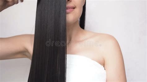 Young Girl Combing Long Smooth Hair After Making A Shower Stock Video