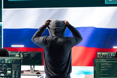 Free Photo Russian Hacker With A Hood Installing Panic By