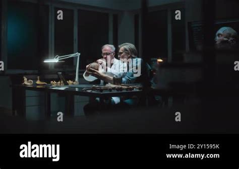 Two Archaeologists Examine Skull Of Prehistoric Human Conduct Scientific Research On Fossil