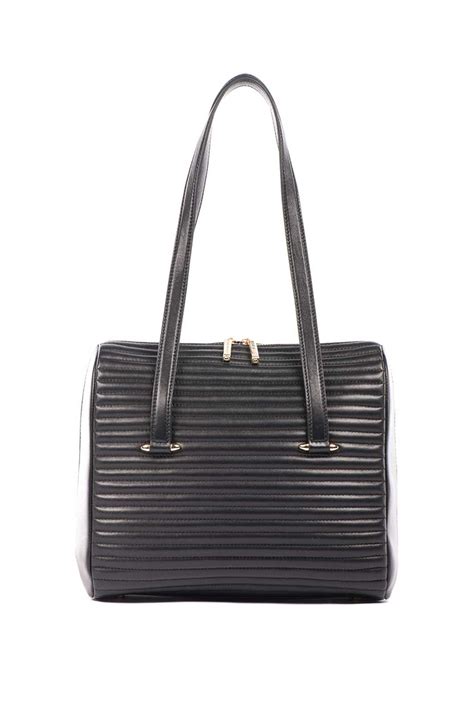 Celine Dion Returns With A New Handbag Line A New Song And New Style